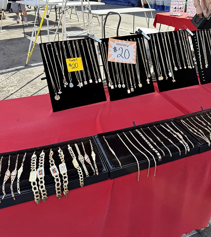 Silver jewelry displayed against black velvet like tiny treasures in a pirate's chest, affordable elegance for everyone.