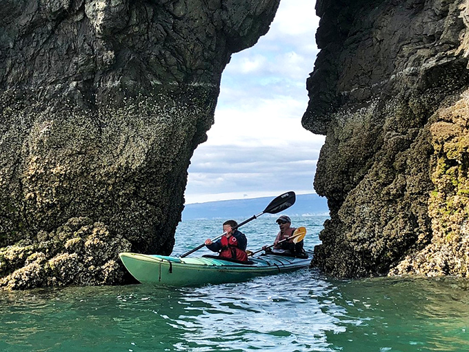 Kayaking through rock formations in Kachemak Bay&mdash;nature's version of threading the needle, just wetter and more magnificent.