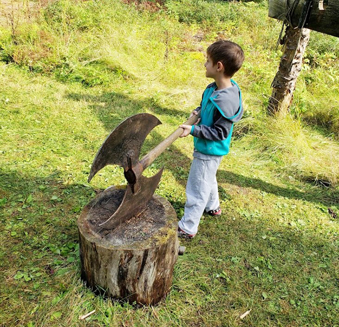 Future knight-in-training tests his mettle with a battle axe display. Mom's insurance policy is definitely getting a workout today. 