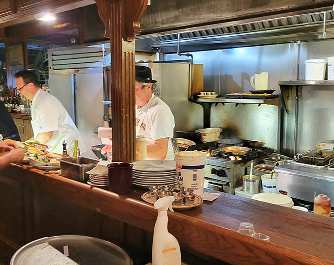 Behind the scenes where the magic happens. Those aren't just cooks—they're seafood alchemists turning simple ingredients into gold.