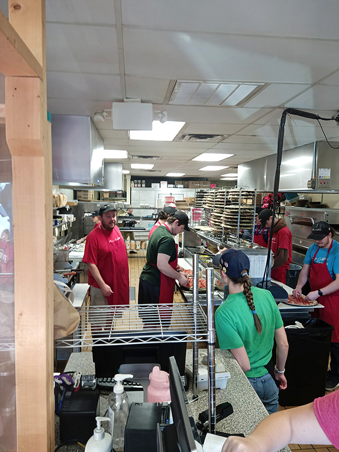 The kitchen ballet&mdash;where timing is everything. This behind-the-scenes glimpse shows the orchestrated chaos that produces pizza perfection.
