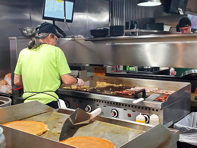 The rhythmic dance of spatulas on the griddle is both culinary performance art and the soundtrack to your impending breakfast satisfaction.