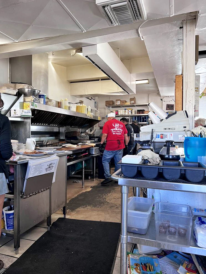 The "Don't Worry Be Happy" shirt says everything about the kitchen philosophy. Good food doesn't need to be complicated.