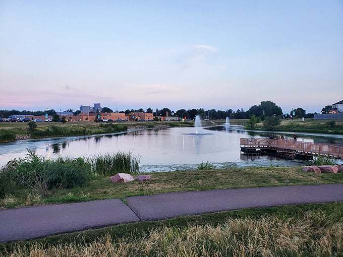 Lake Ole's fountains and walking path create a peaceful oasis at sunset, proving that Harrisburg understands the importance of beautiful public spaces in creating community.
