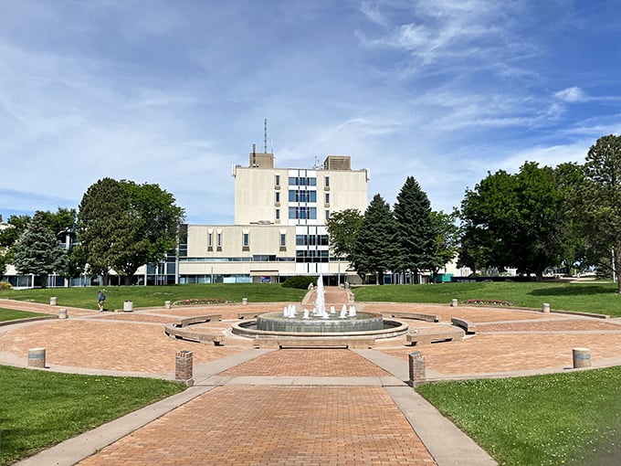 This fountain plaza creates a serene gathering space where water dances while students and locals take a moment to breathe.