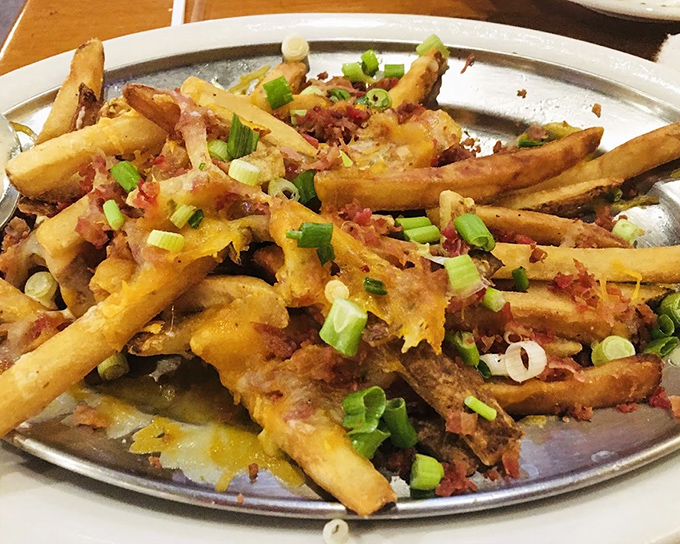 Loaded fries that blur the line between appetizer and main course&mdash;a mountain of potato, cheese, and bacon that demands to be shared.
