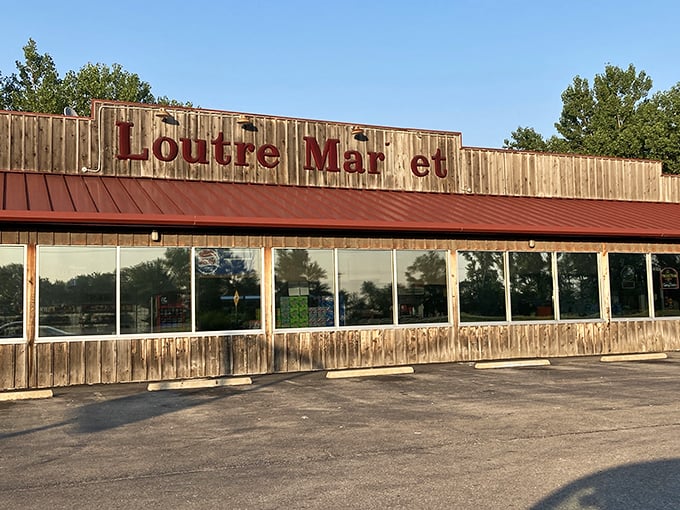 Loutre Market serves the community with small-town charm, its weathered wooden sign suggesting decades of service to Hermann residents.