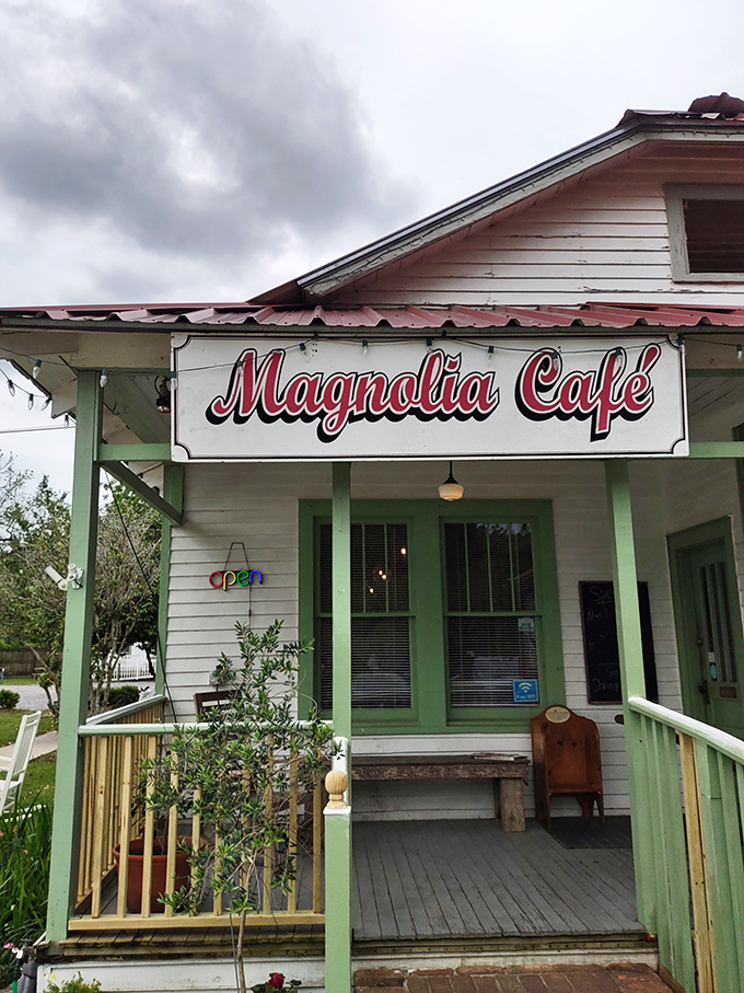 The Magnolia Café's front porch practically demands you slow down, sit a spell, and remember when conversations happened face-to-face, not screen-to-screen.