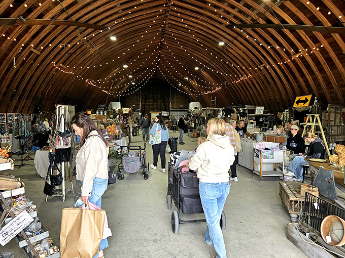 String lights transform this rustic barn into a magical marketplace where vintage finds and handcrafted treasures await discovery.