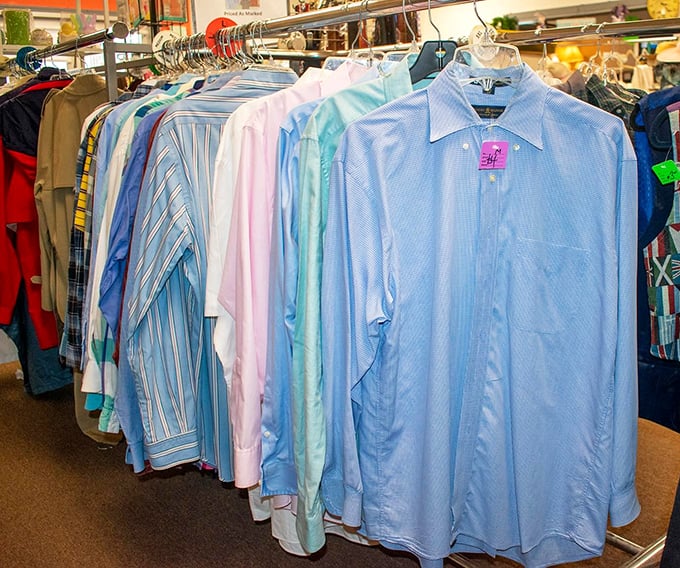 Men's dress shirts arranged in a gradient of blues, each one pressed and ready for its workplace comeback.