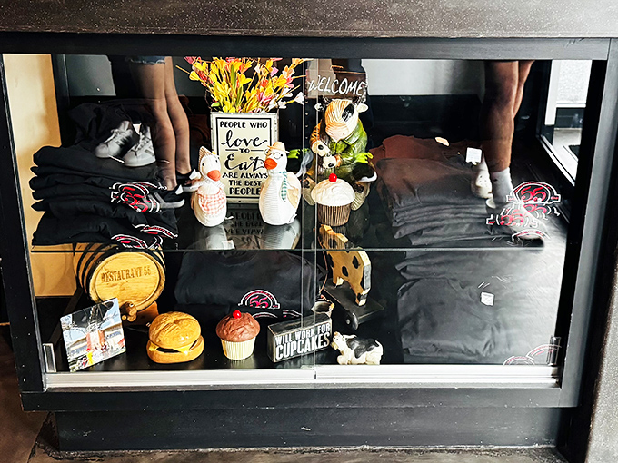 The merchandise display case proves that some dining experiences deserve souvenirs. "I conquered the Bronto Burger and all I got was this t-shirt."