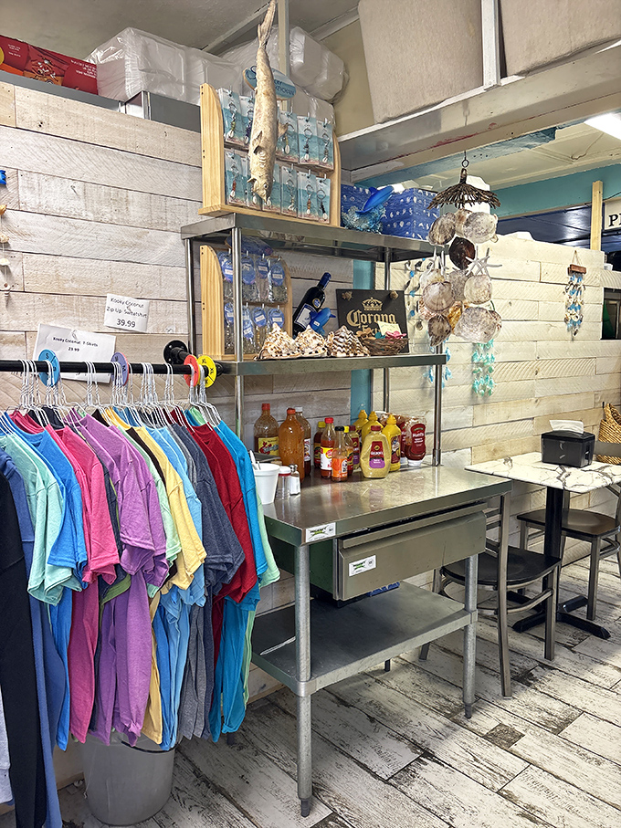 Beach essentials beyond food. Colorful t-shirts, souvenirs, and coastal decor let you take a piece of the Kooky Coconut experience home.