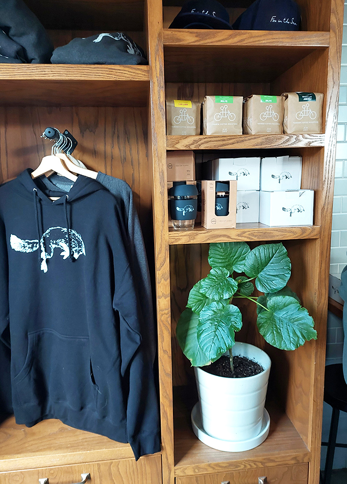 Merch corner meets plant parenthood. That fox logo hoodie isn't just clothing&mdash;it's a badge of honor among Columbus coffee connoisseurs who know quality.