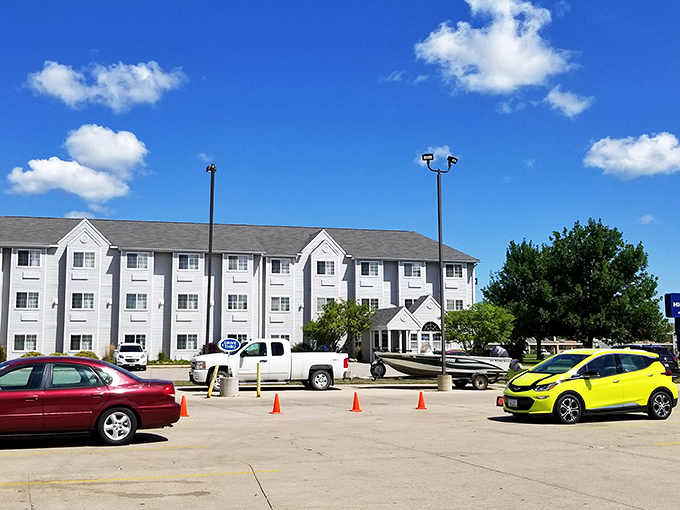 The Microtel stands ready for weary travelers, a modern oasis where the ice machines actually work and the parking is mercifully flat.