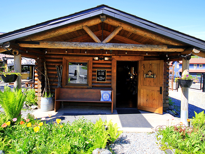 Log cabin perfection: This little shop embodies the Alaskan dream &ndash; rustic, welcoming, and framed by wildflowers that thrive in the brief summer.