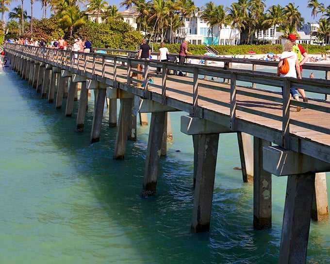 Naples Pier stretches toward the horizon like a runway for launching perfect sunset photos that will make your social media followers weep with envy.