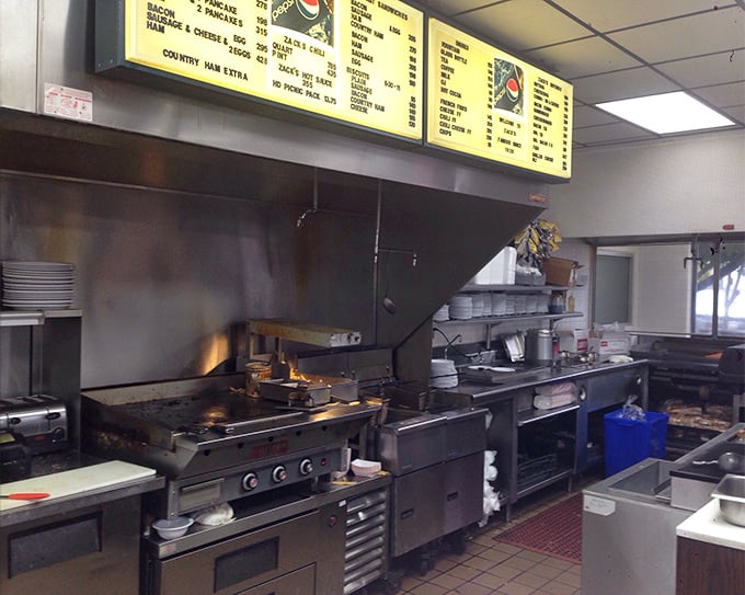 Behind the scenes, the well-seasoned kitchen equipment has been turning out perfect hot dogs for decades.
