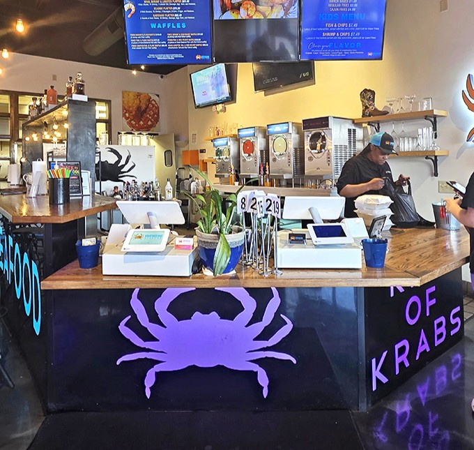 Behind this counter, seafood dreams become reality&mdash;where orders are placed and anticipation begins its delicious climb.