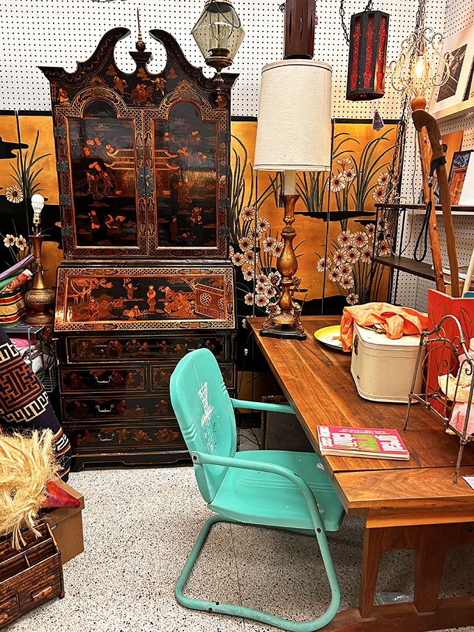 An Asian-inspired secretary desk that makes your IKEA furniture hang its head in shame. That turquoise chair adds the perfect pop of mid-century charm.