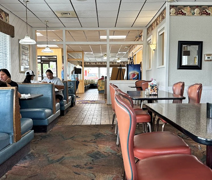 The diner's interior stretches before you like a runway of comfort&mdash;each booth a potential destination for your taste buds' next adventure.