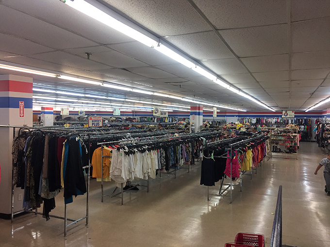 The clothing forest extends to the horizon. Like an archaeological dig through fashion history, each rack reveals another cultural layer.