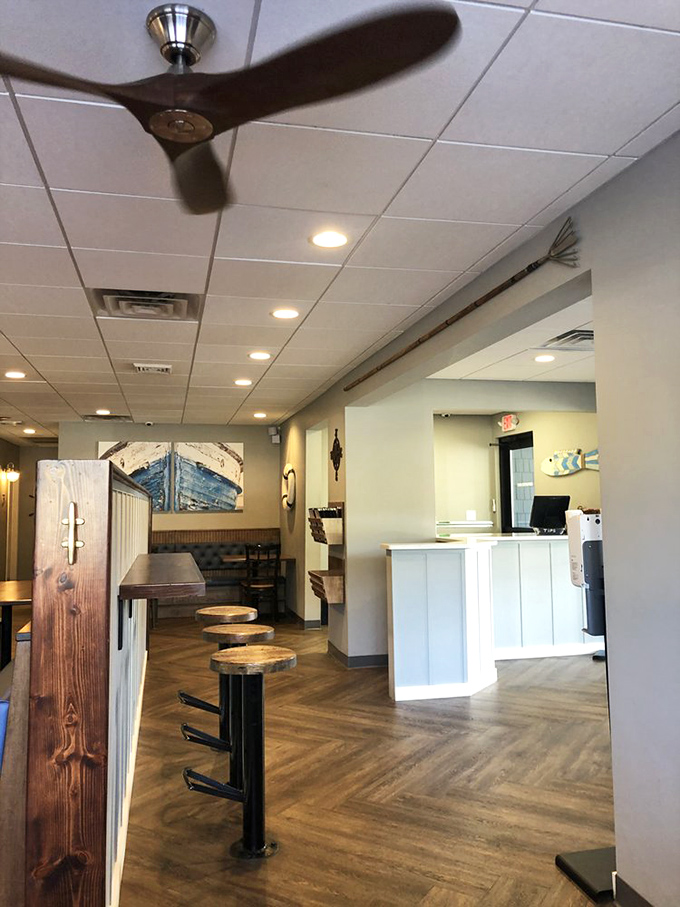A glimpse into the restaurant's thoughtful layout, where nautical charm meets practical dining. Those bar stools have heard countless seafood satisfaction sighs.