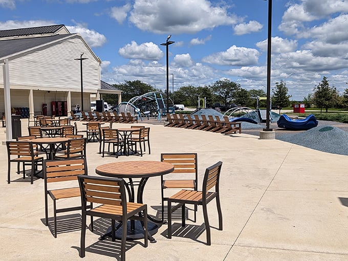 Outdoor seating area where exhausted partners recharge while calculating how many more stores their patience can endure.