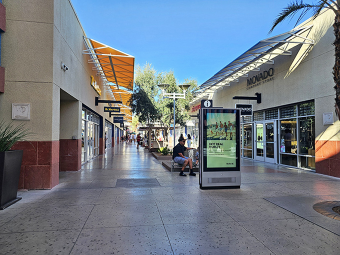 Sunlight bathes the walkways between stores, creating an almost resort-like atmosphere where the only pressure is deciding which deal to pursue next.