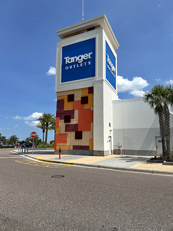 The tower stands guard over endless deals, its mosaic pattern matching the colorful chaos of shopping bags.