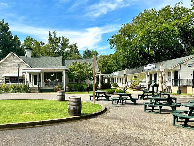 Outdoor seating where picnic tables and barrels create the perfect post-meal gathering spot. Fresh air makes room for second helpings.