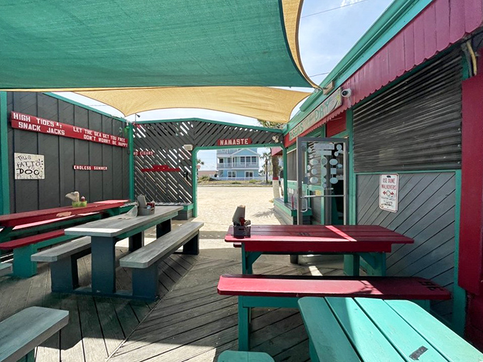 The covered deck offers al fresco dining with a side of salt air &ndash; picnic tables painted in colors that would make a parrotfish jealous.