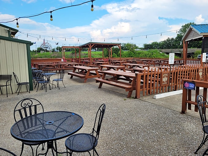 The outdoor seating area&mdash;where summer evenings turn into perfect memories. String lights overhead like stars blessing your meal.