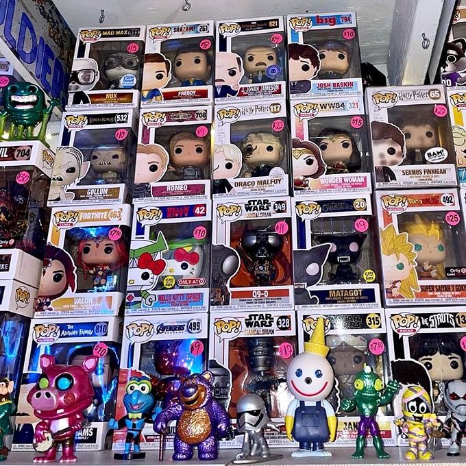 POP! figurines stacked like a plastic pantheon of pop culture, where Darth Vader neighbors with Hello Kitty.