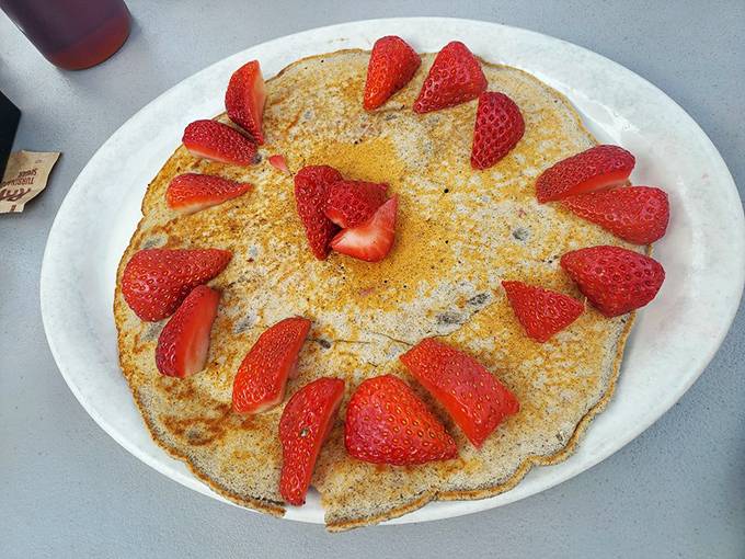 Pancakes arranged like a clock face of strawberries, telling you it's officially time to indulge without regret.