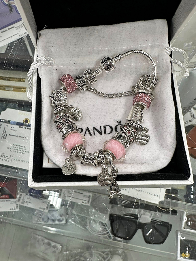 This Pandora bracelet tells someone else's story&mdash;now waiting for you to add the next chapter with its pink charms.