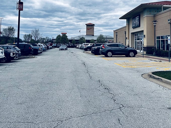 The parking lot – first battlefield of the outlet shopping experience. Veterans know to photograph their location or face the dreaded post-shopping scavenger hunt.