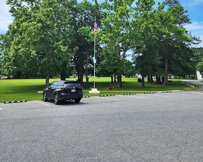 The parking area offers easy access to this slice of Americana, complete with patriotic flag display.
