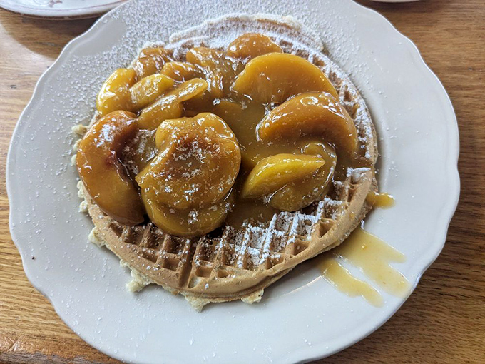 Waffles topped with caramelized peaches &ndash; breakfast's answer to dessert that somehow feels completely appropriate before noon.