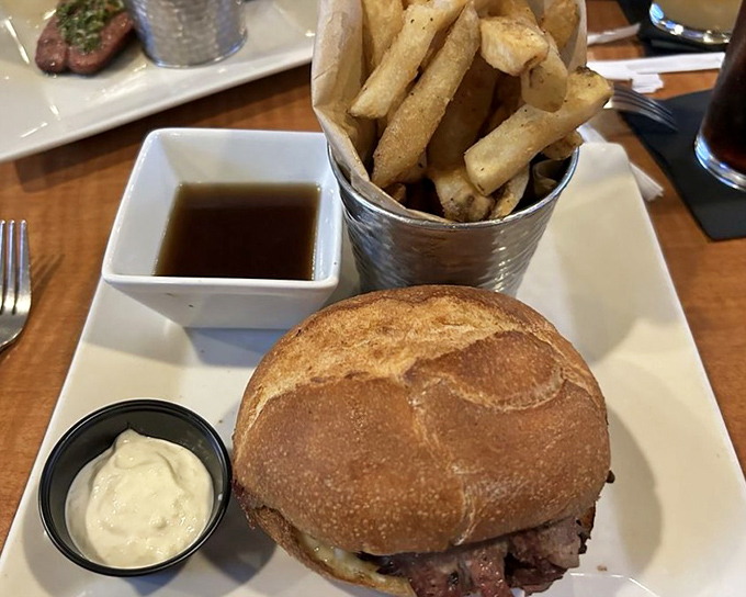 The Pit Beef Melt: where sandwich engineering meets comfort food science, resulting in a handheld masterpiece that requires both hands and your undivided attention.