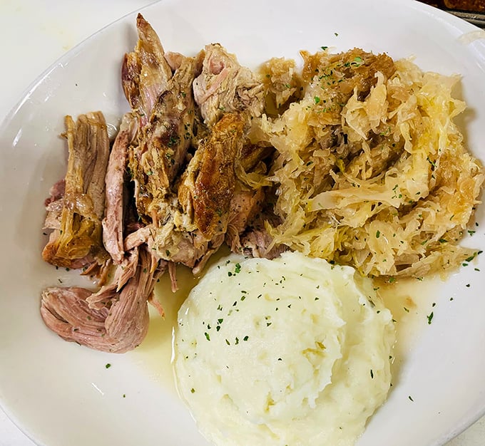 Pork and sauerkraut that honors Pennsylvania Dutch tradition while satisfying modern cravings. Those mashed potatoes are cloud-like perfection.