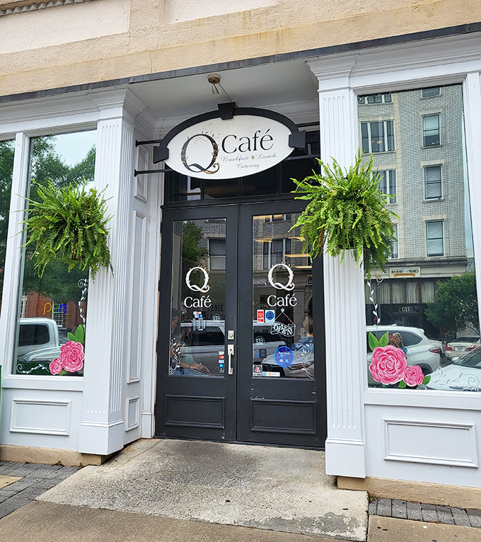Q Caf&eacute;'s inviting entrance, framed by lush ferns and hand-painted roses, beckons breakfast lovers into one of downtown's most cherished morning spots.