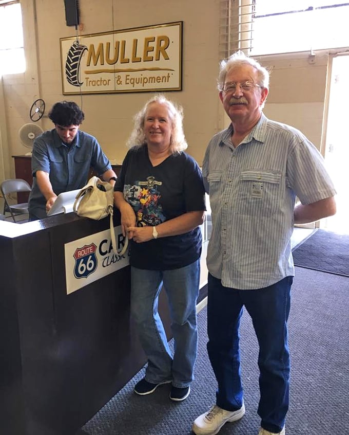 The friendly faces at the reception desk are the first hint that this museum celebrates not just cars, but the people who love them.
