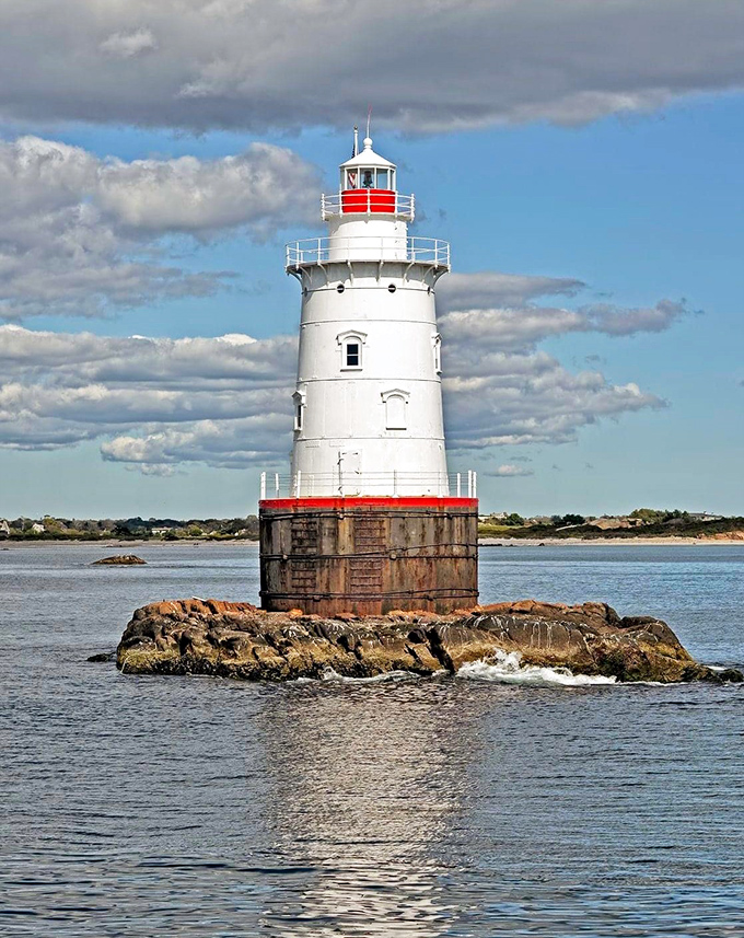 Sakonnet Lighthouse stands sentinel against dramatic skies, a maritime guardian that's witnessed countless storms and sunsets. Engineering meets artistry in classic New England fashion.