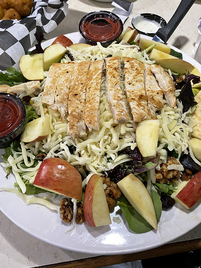 A salad this thoughtfully constructed&mdash;with grilled chicken, fresh apples, and what appears to be candied walnuts&mdash;proves healthy eating needn't be punishment.