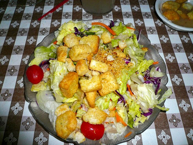 A salad that doesn't apologize for being a salad. Those golden croutons and fresh vegetables are the supporting actors in your meat-centric drama.