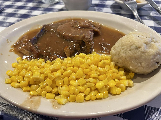 Sauerbraten with gravy that should be declared a national treasure, alongside corn that actually tastes like corn and a dumpling that floats like a carb cloud.