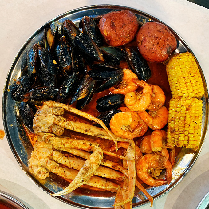The ultimate seafood summit meeting: crab legs, mussels, shrimp, and corn negotiating deliciously in a spice-infused broth. Diplomacy never tasted so good.