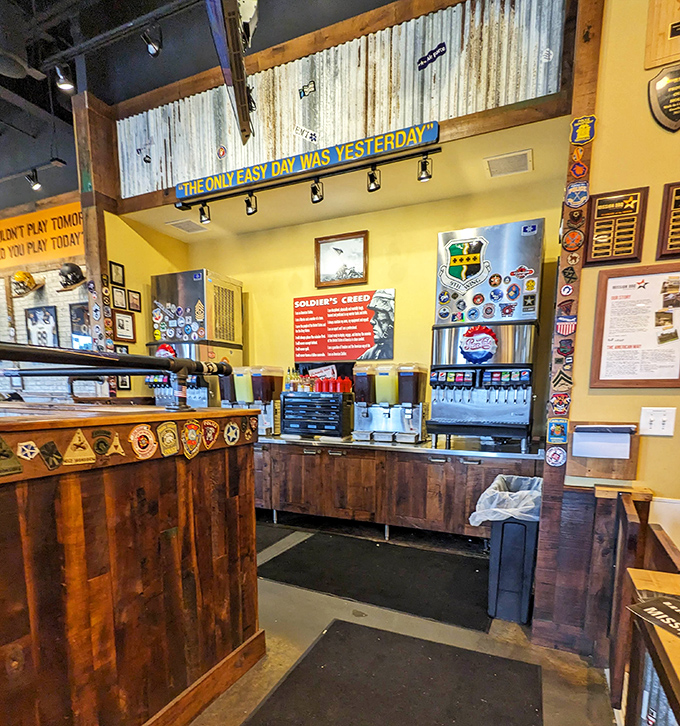 Self-service drinks and condiments await, with inspirational quotes reminding you that "The Only Easy Day Was Yesterday" while you refill sweet tea.