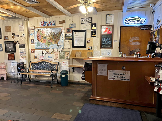 The waiting area isn't just functional&mdash;it's a museum of local pride. That map tracks where BBQ pilgrims have traveled from.