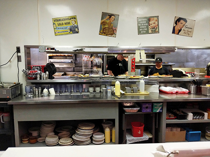 The service counter reveals stacked plates and busy hands, evidence that this operation runs smoother than your morning commute ever will.